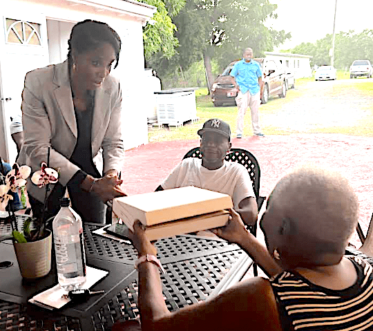 Plaskett Presents U.S. Flag to Raymond Williams and Family | St. John ...